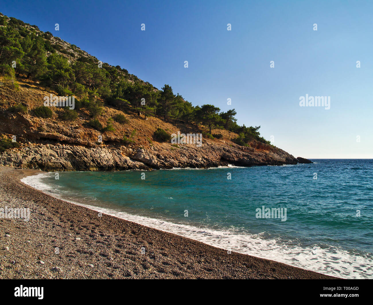 Isolated empty beautiful stone beach at summer time, in central west ...