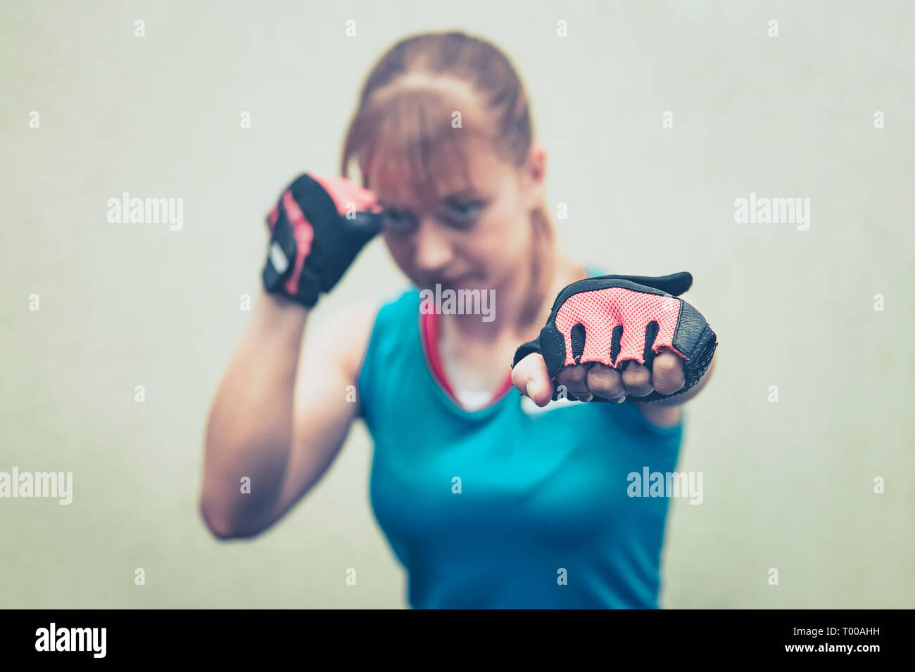 threatened with fists. close unarmed. Fist in the foreground. Girl ...
