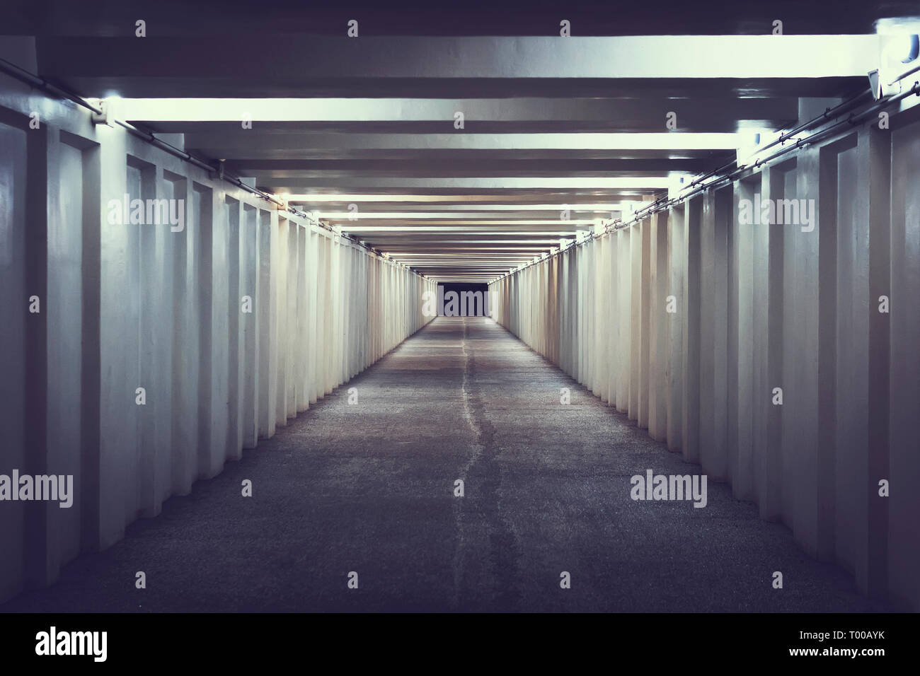 Highway tunnel. Interior of an urban tunnel without traffic. Pedestrian ...