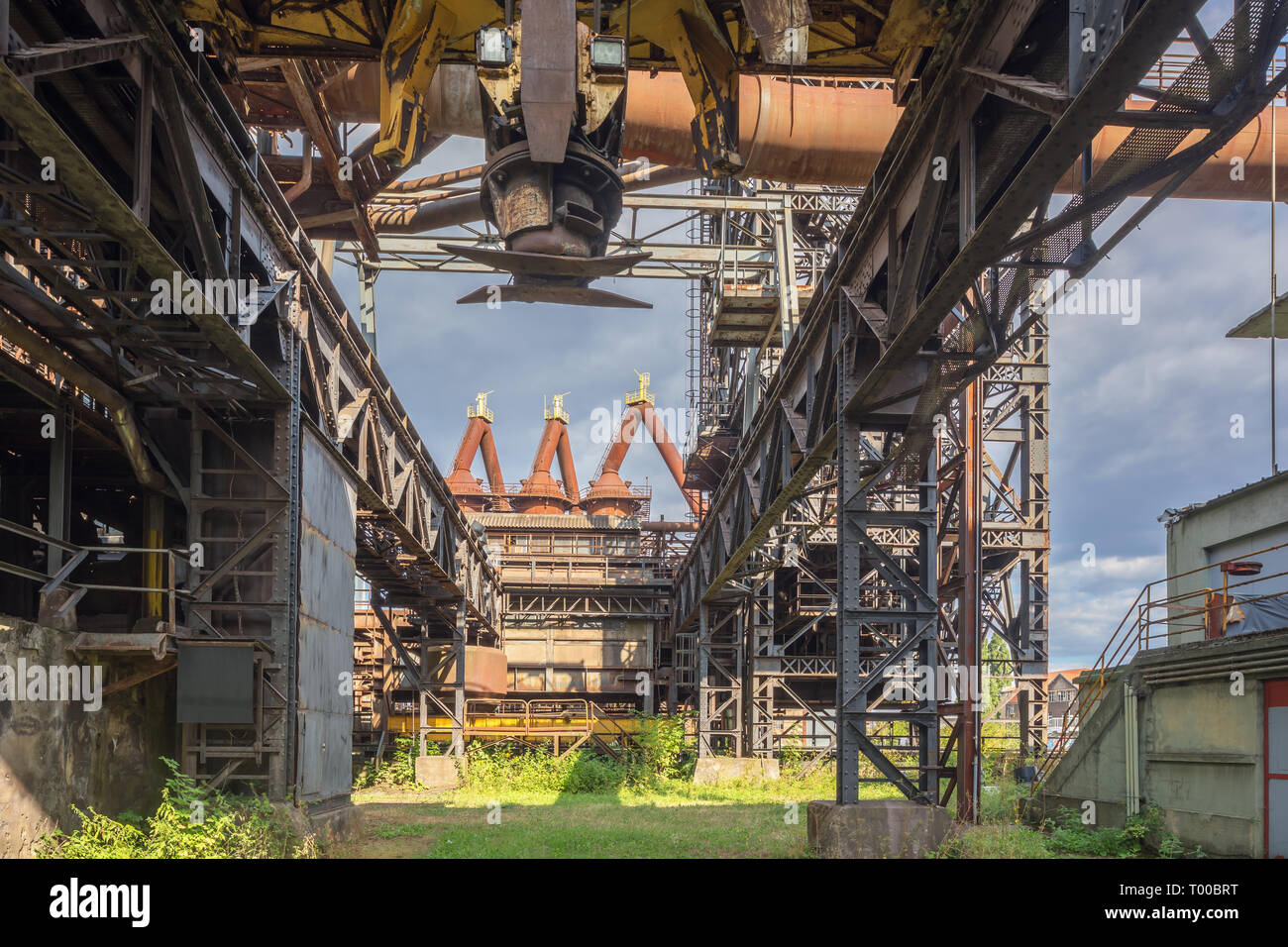 Under a giant electromagnetic crane in the blast furnace park of ...