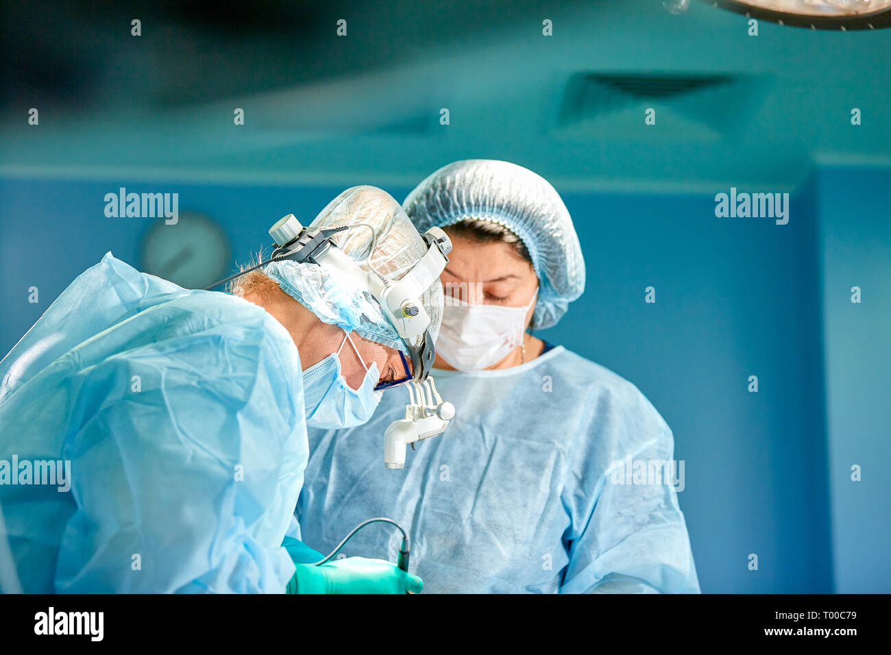 Portrait of a surgeon close-up. Surgeons operate on a patient. Tense ...