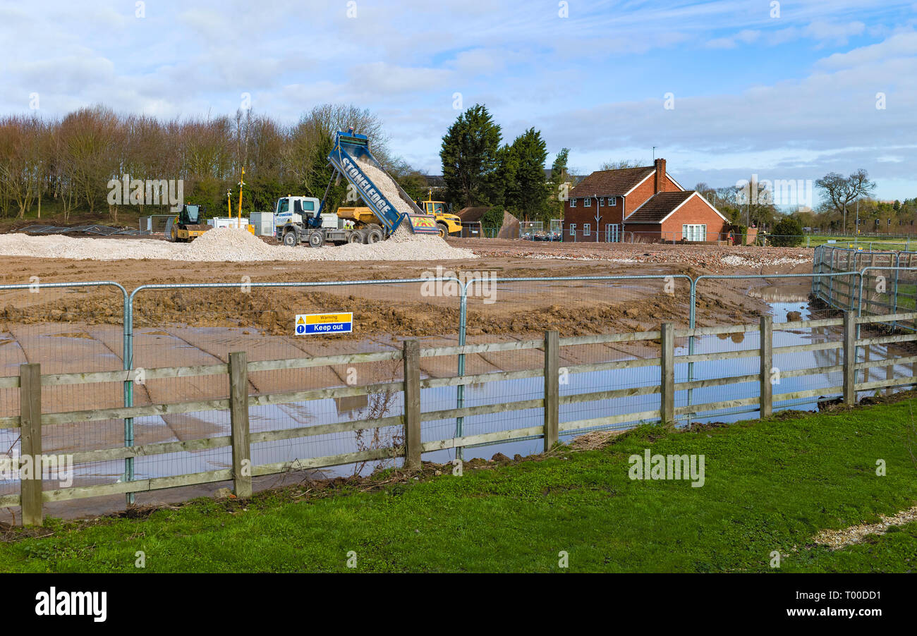 Construction work with heavy machinery replacing old knackers yard with ...