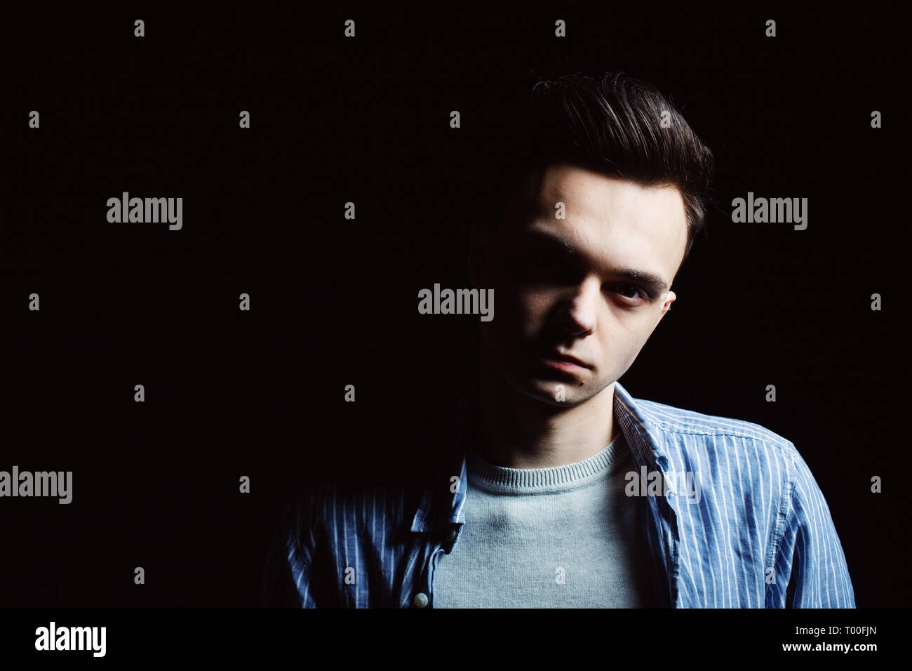 Low key portrait cute boy hi-res stock photography and images - Alamy