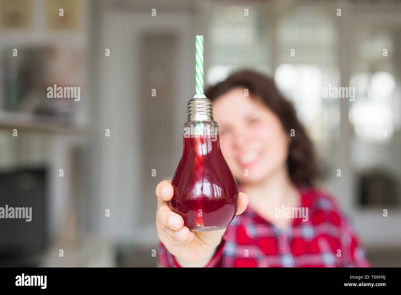 Drinks, diet and healthy lifestyle concept - woman giving you a bottle ...