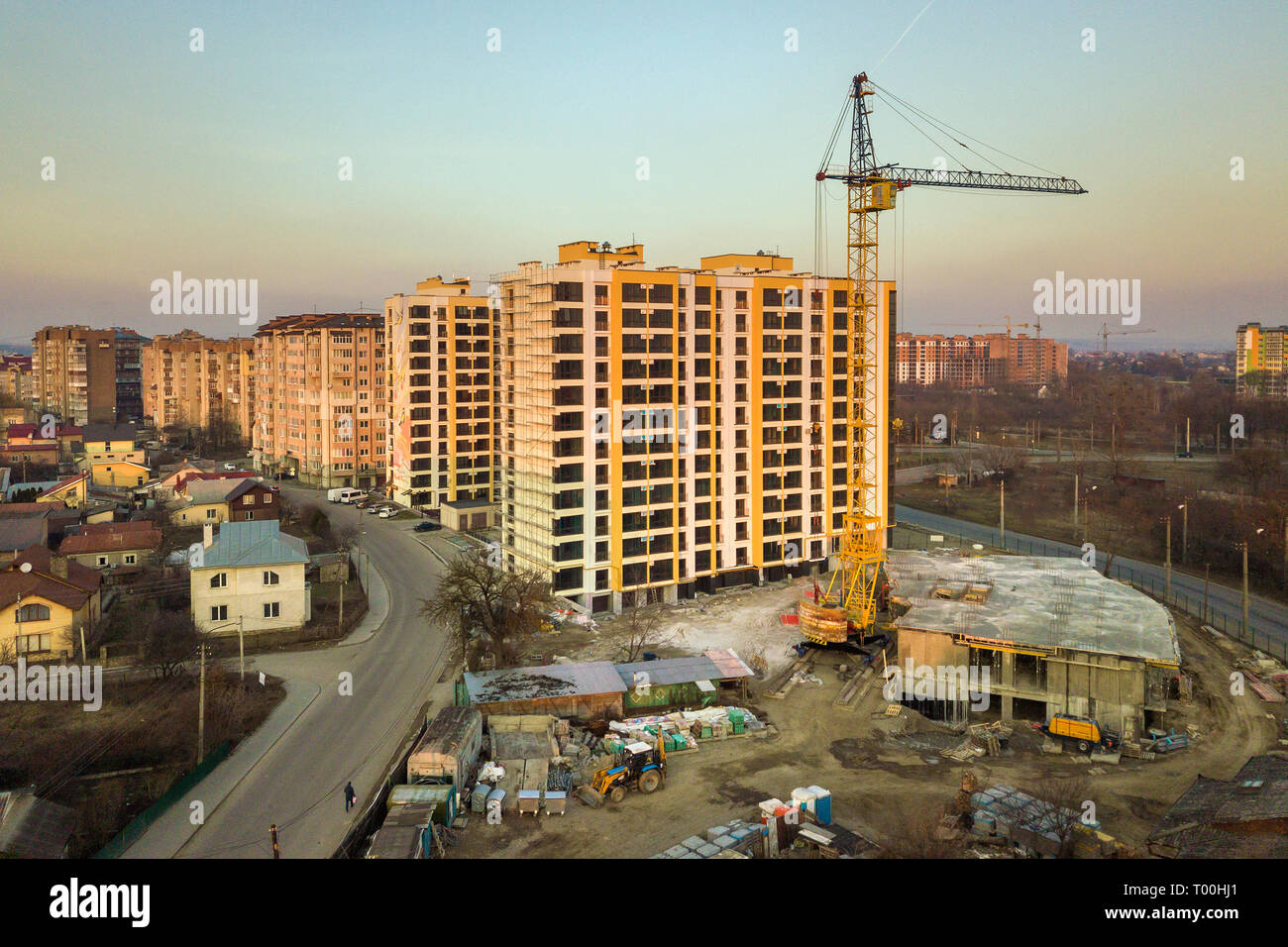 Aerial view of tall apartment building complex, unfinished building ...