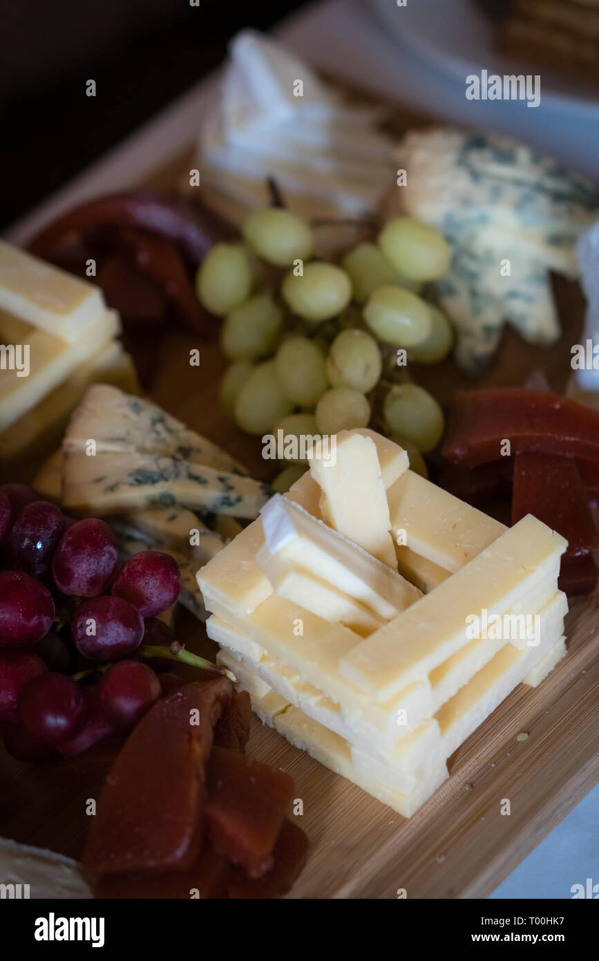 Cheese platter with different cheeses including brie, cheddar and blue ...