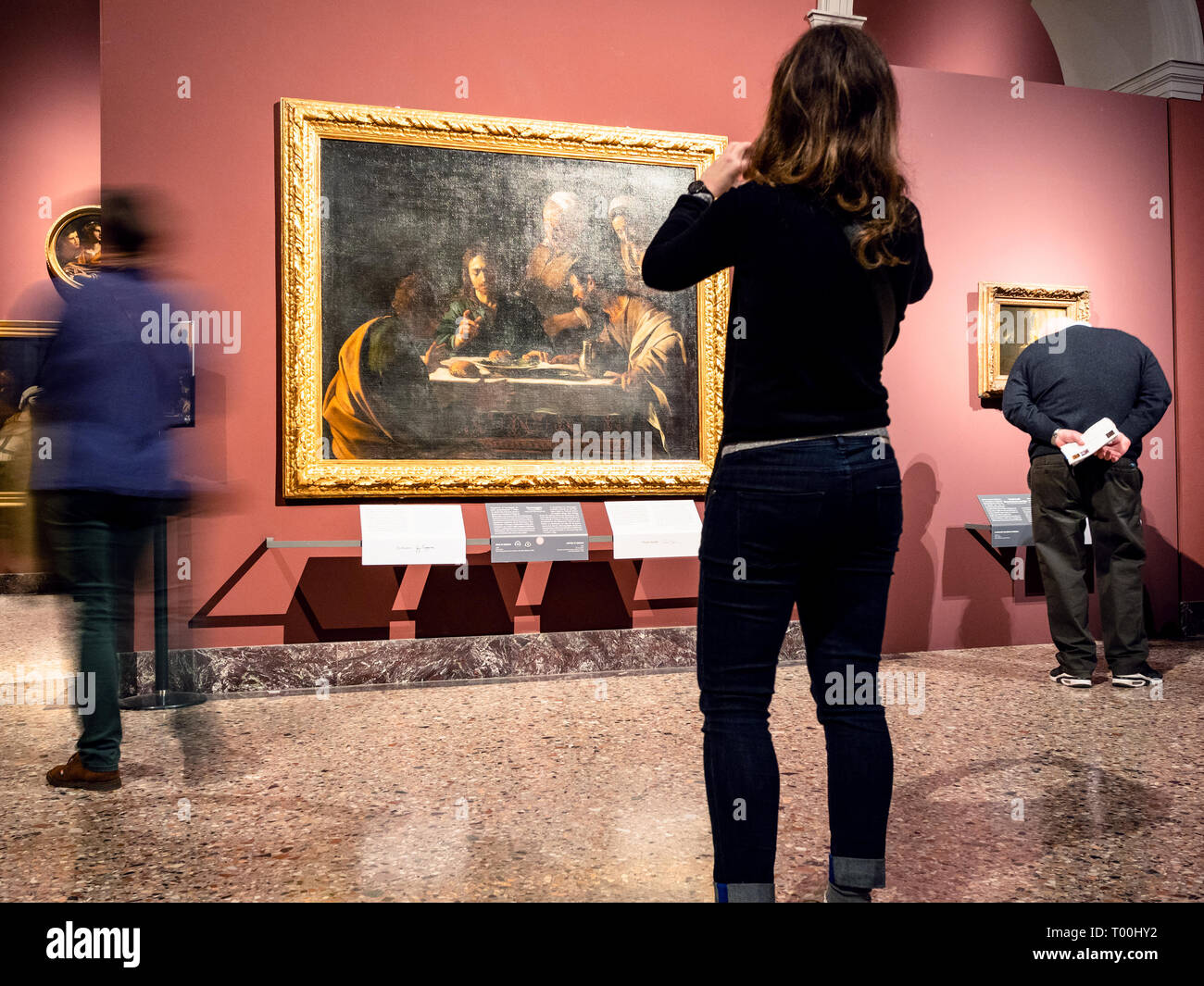 MILAN, ITALY - FEBRUARY 24, 2019: woman photographs picture in Pinacoteca di Brera (Brera Art ...
