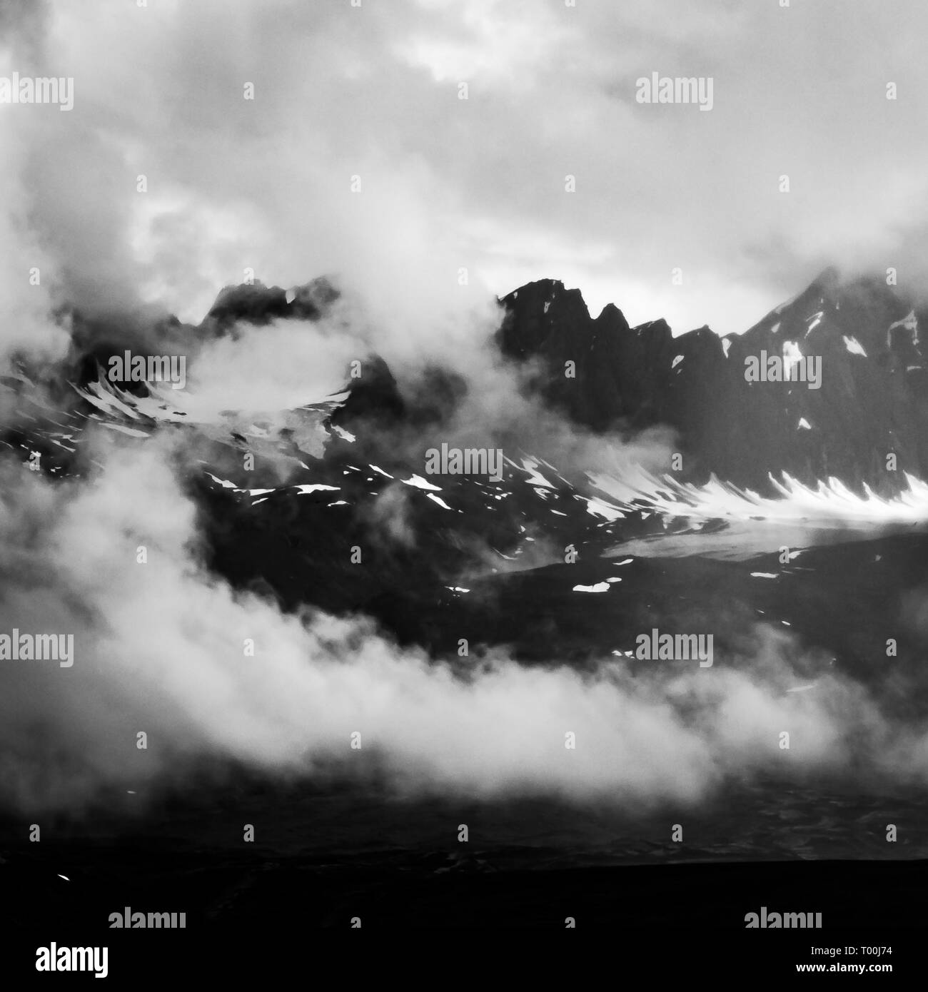 Black and White of Alaskan Mountains in the Mist Stock Photo - Alamy