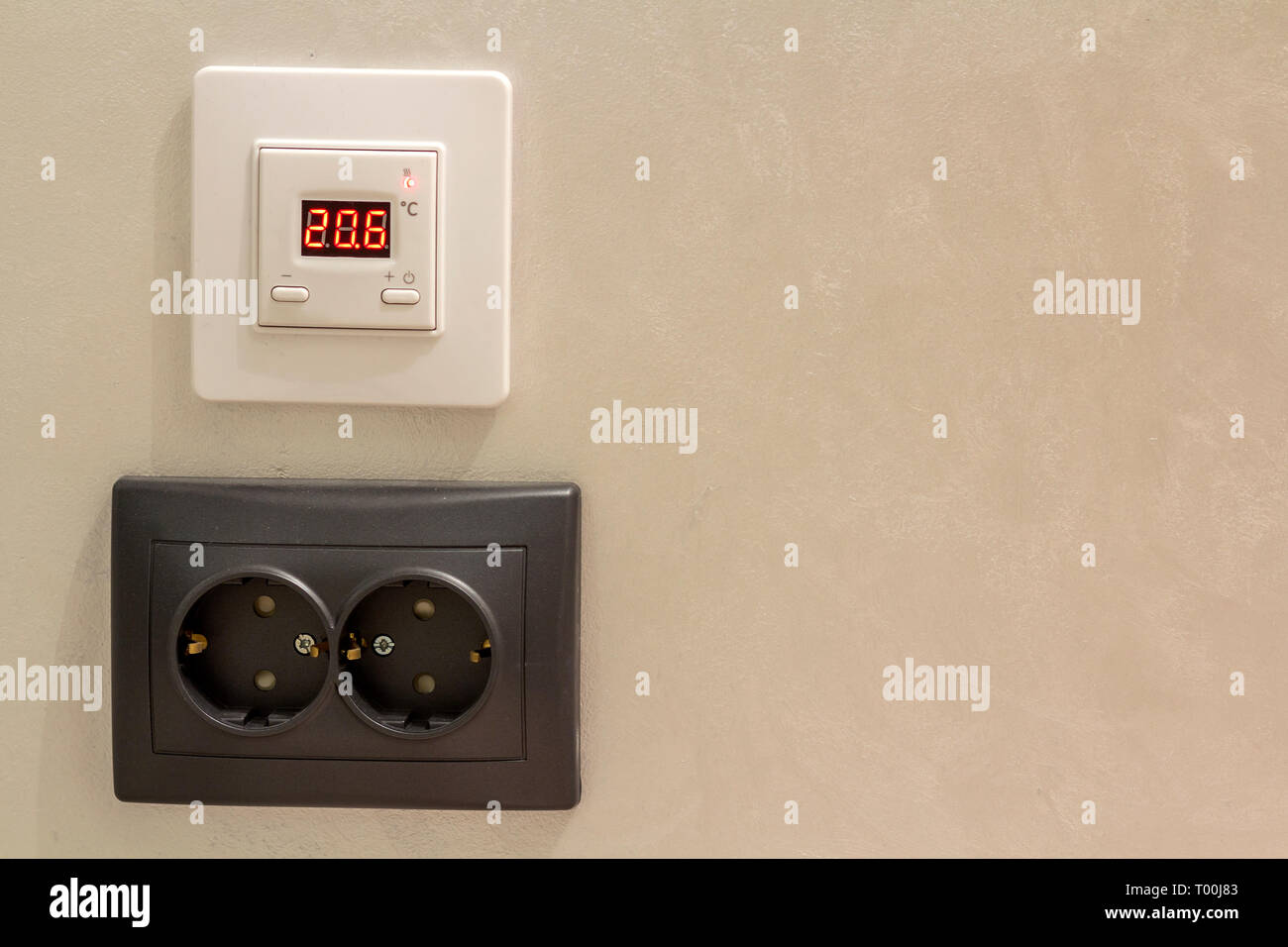 Double electric isolated socket and thermostat installed on light ...