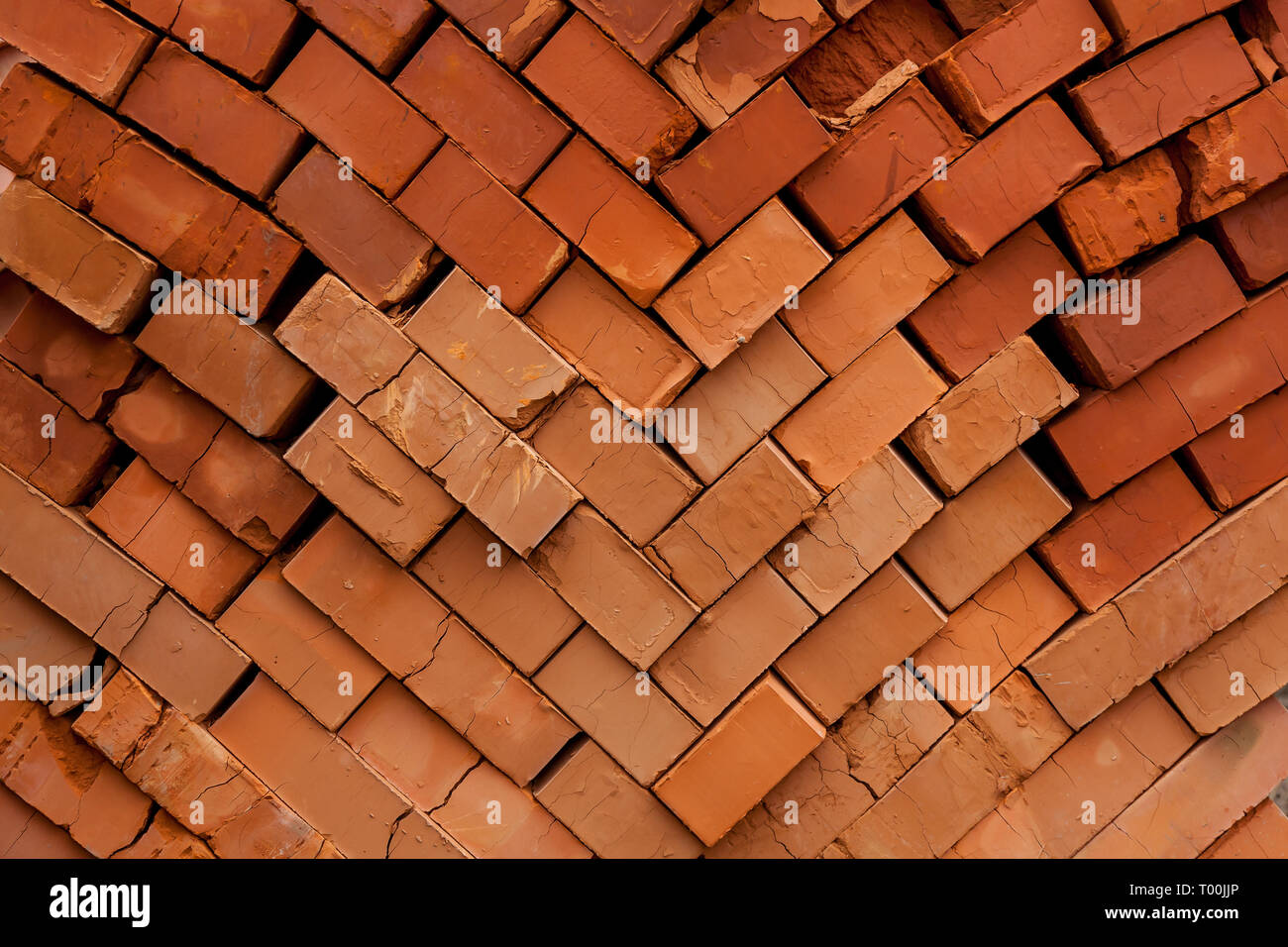 Walls of a multi-storey red brick house. Construction site, tools ...