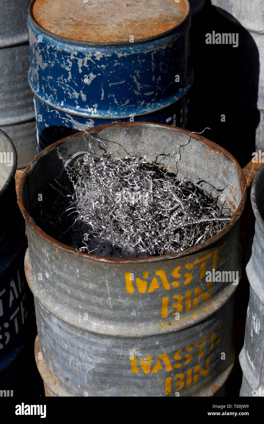 Metal waste bin storage area outside engineering works awaiting ...