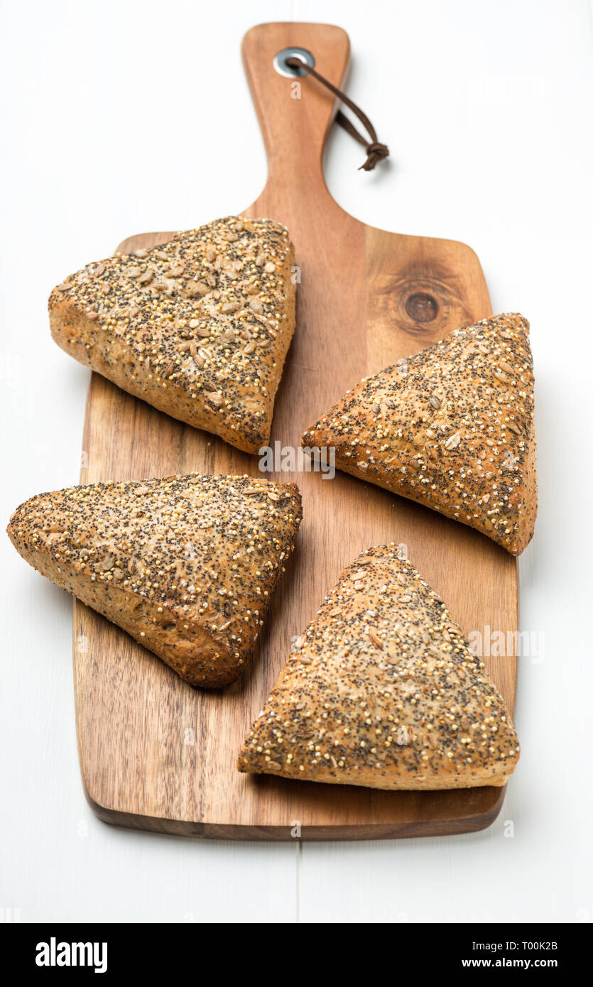 bread rolls on a chopping board Stock Photo - Alamy