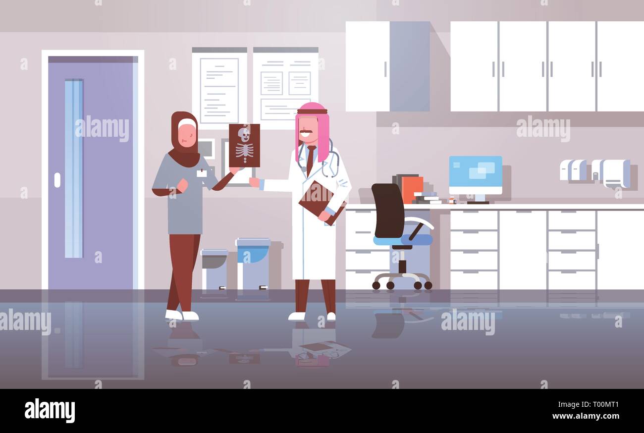 arab doctor and nurse examining x-ray hospital workers looking patient ...