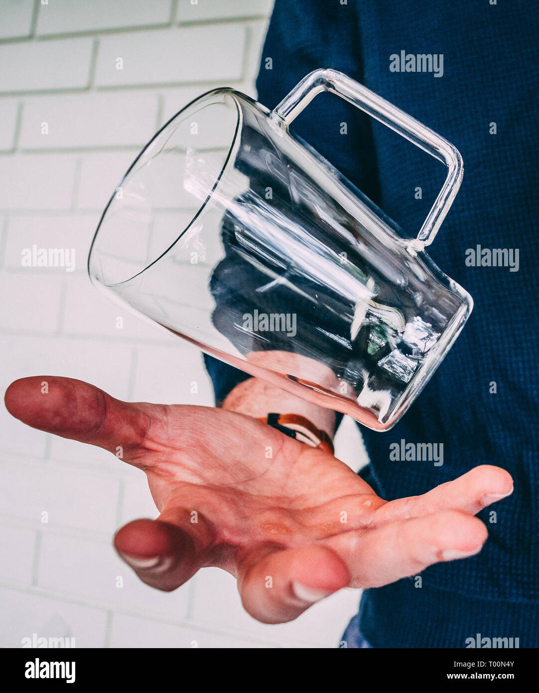 the floating glass over hand Stock Photo - Alamy