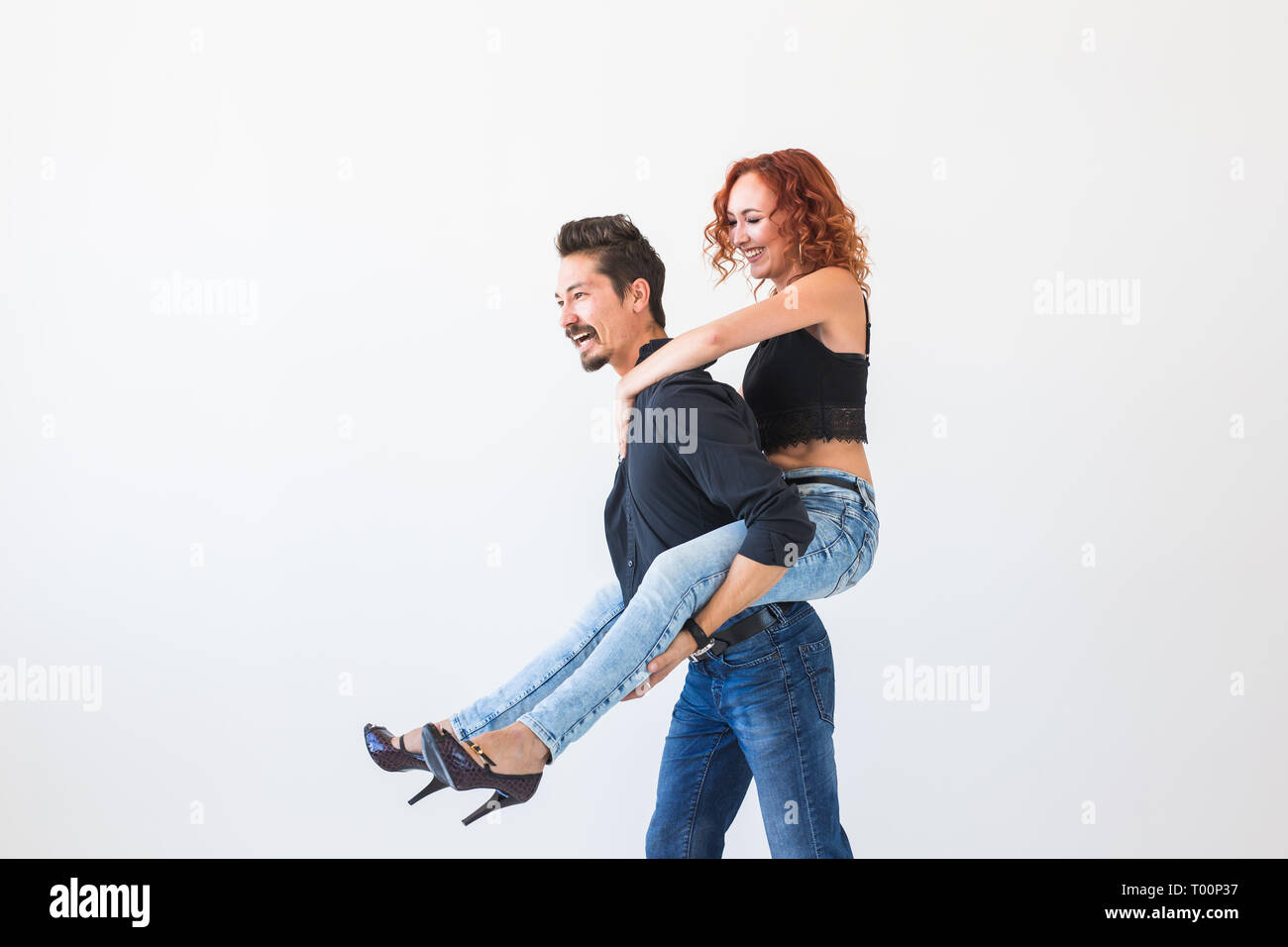 Friendship, people concept - young woman jumped on the man's back Stock ...