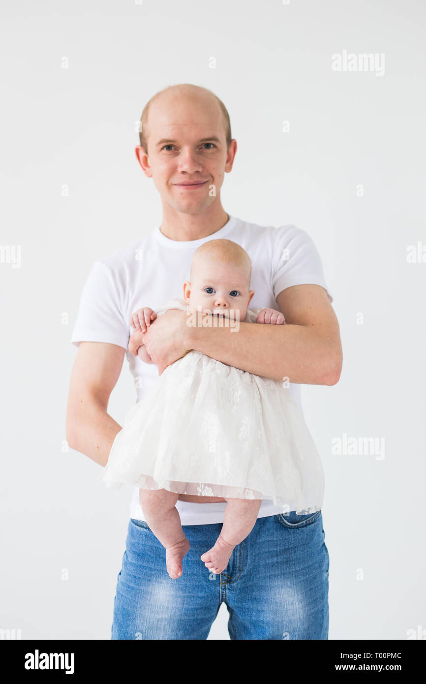 Childhood, family and fatherhood concept - proud bald father holding ...