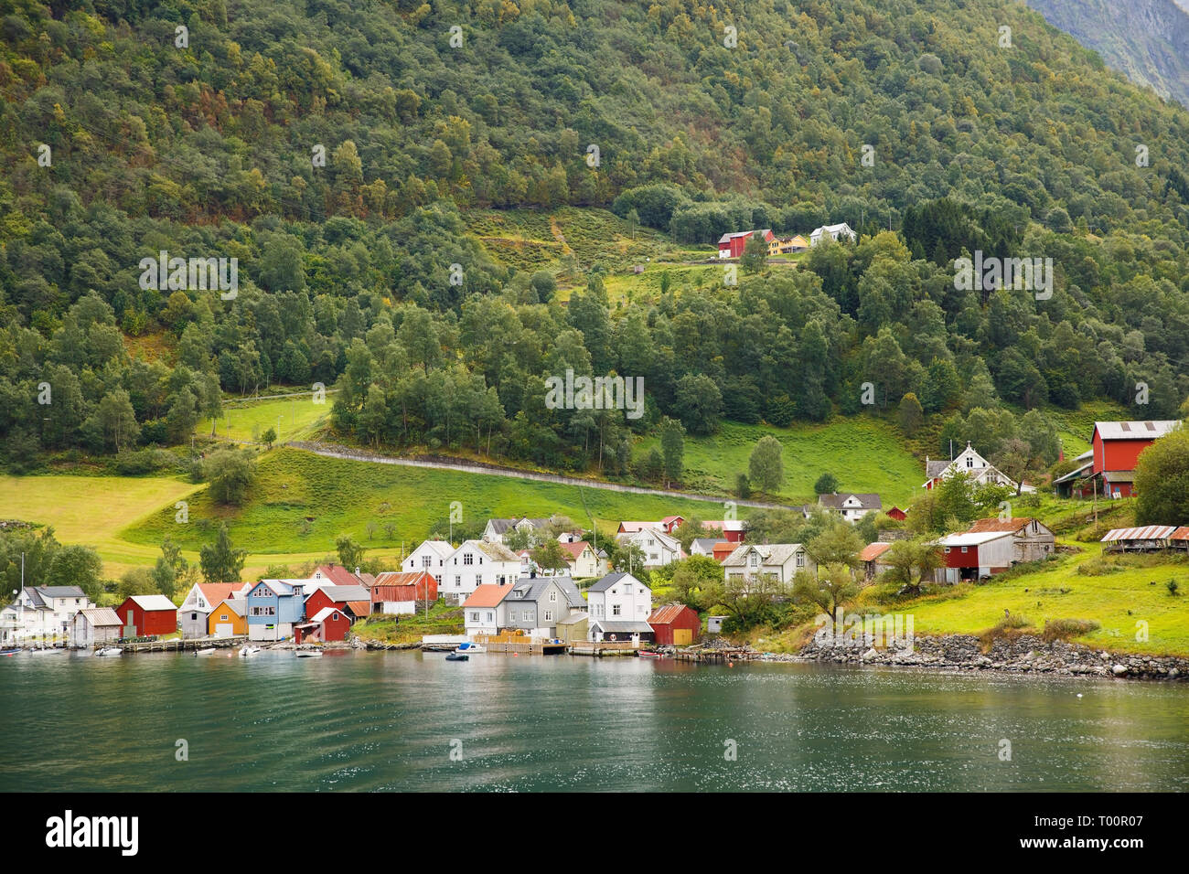 Landscape with Naeroyfjord, mountains and traditional village houses in ...