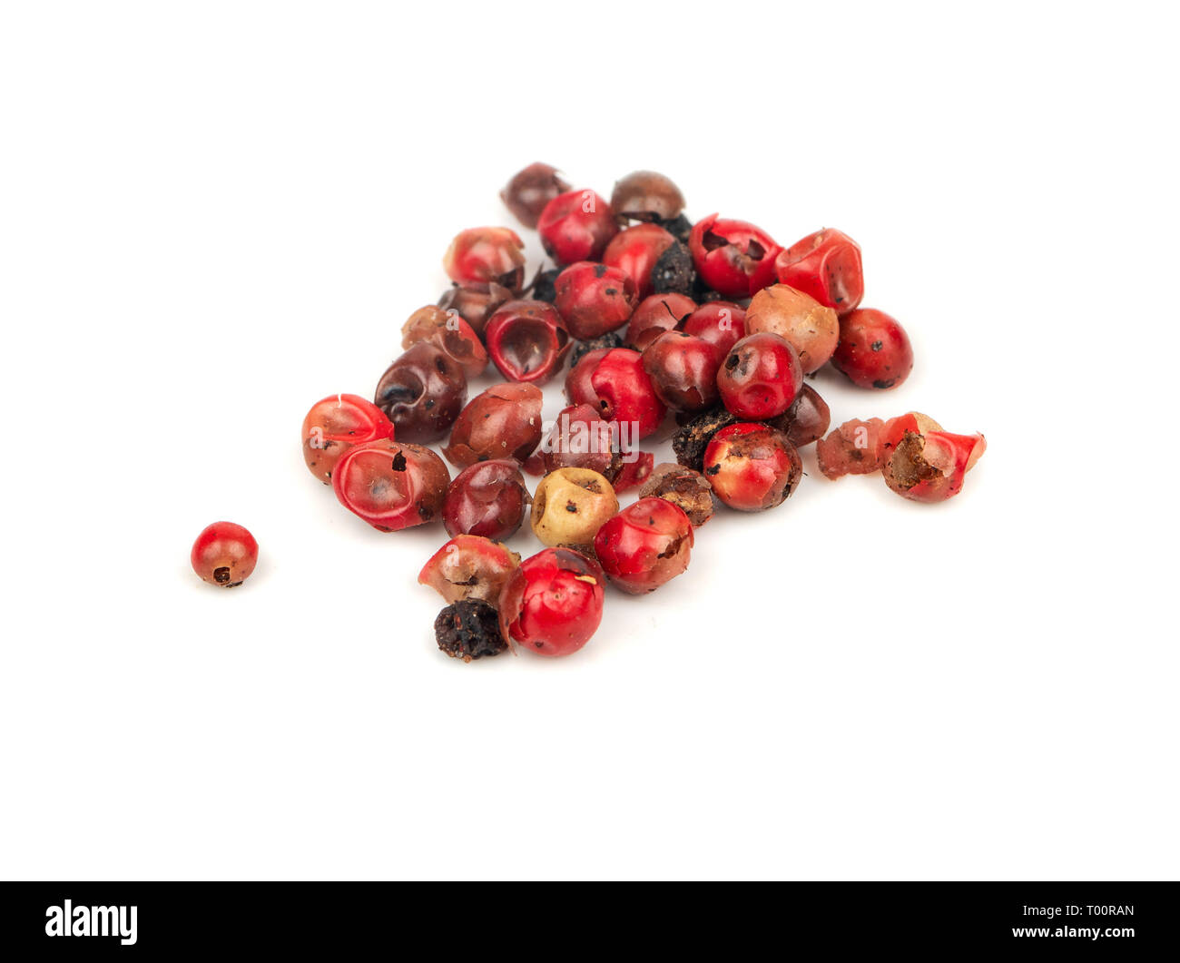 Several scattered red peppers on a white background Stock Photo - Alamy