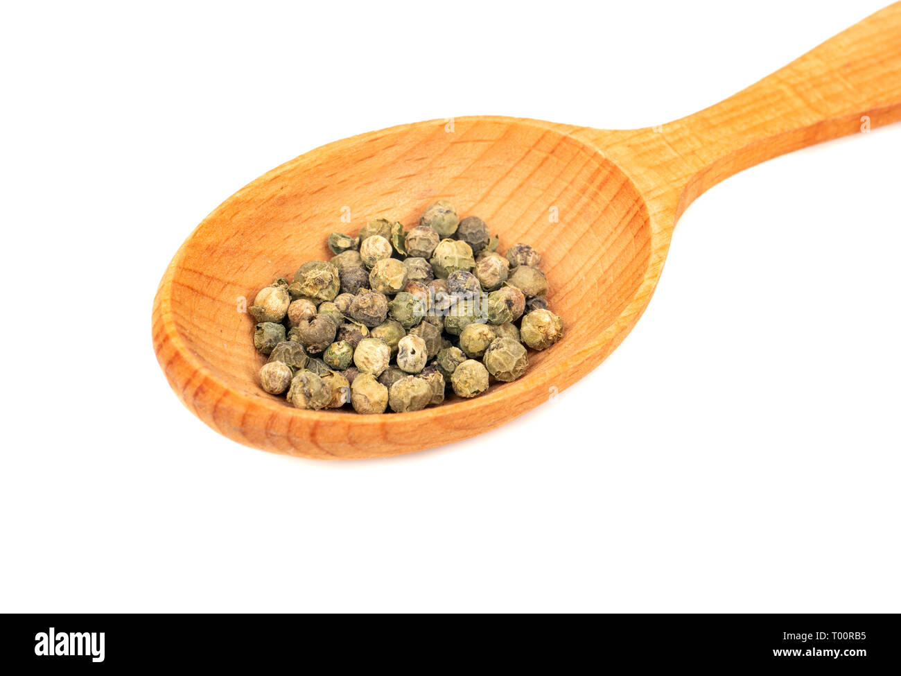 Wooden spoon with green pepper peas on white background Stock Photo - Alamy