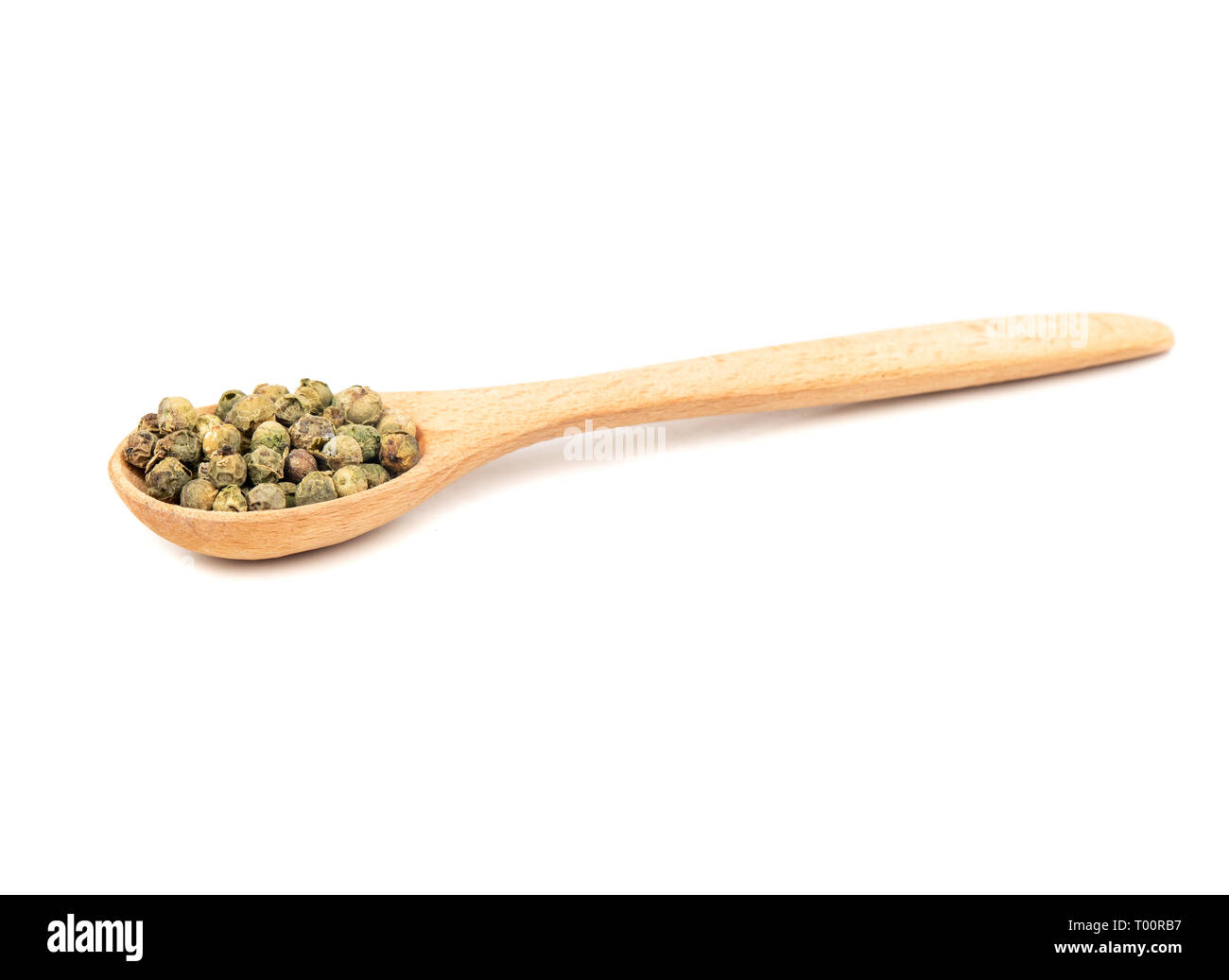 Green pepper peas in a small wooden spoon on a white background Stock ...