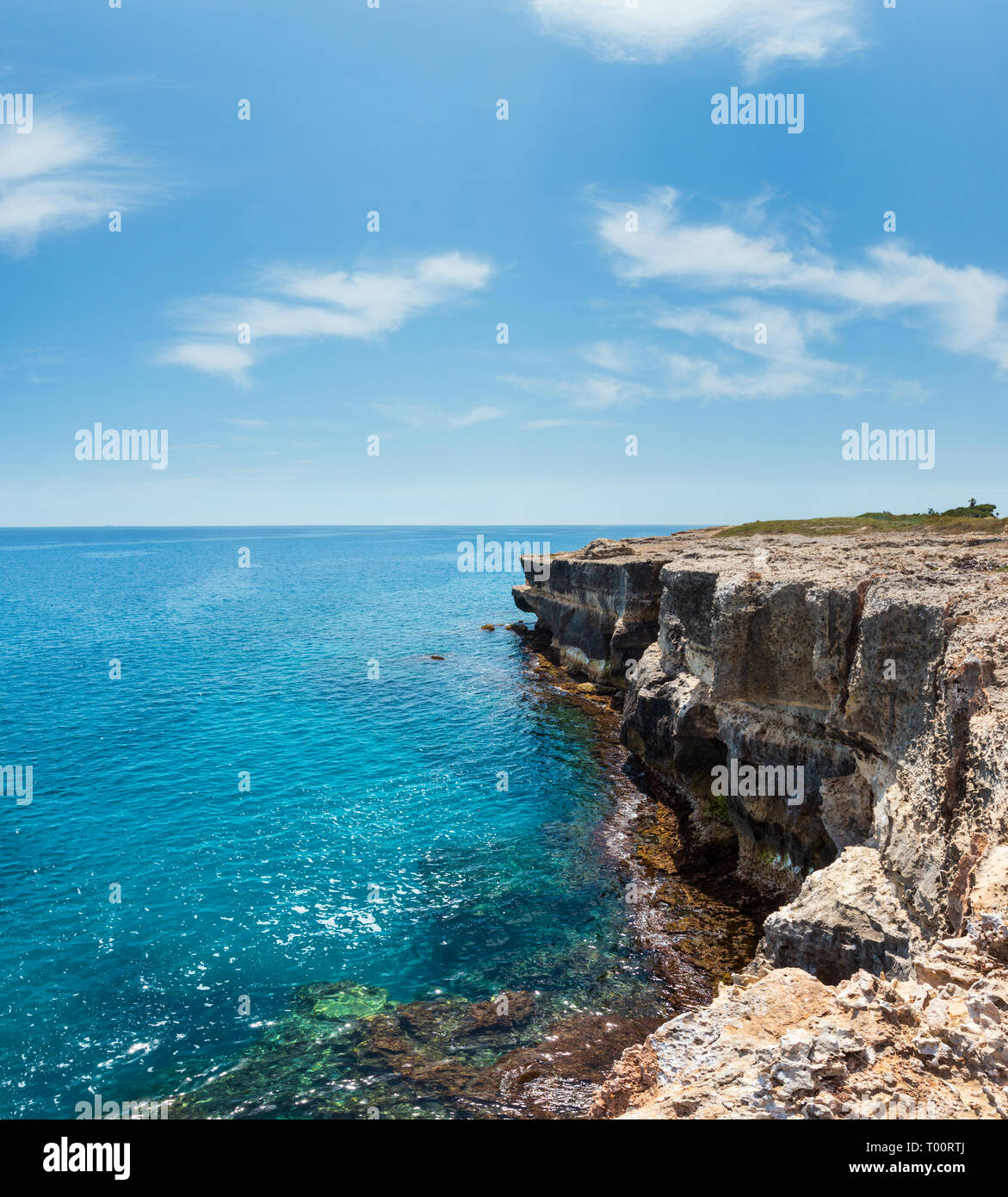 Picturesque seascape with white rocky cliffs, caves, sea bay and islets ...