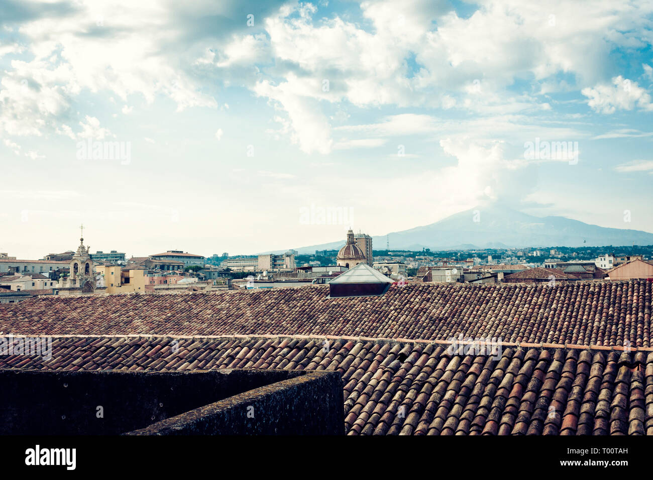 Catania aerial cityscape with Mount Etna, active volcano on the east ...