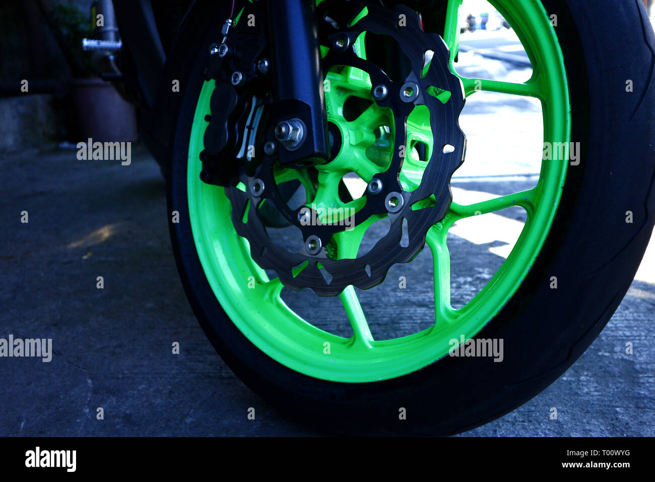 Photo of a disc brake on the front tire of a motorcycle Stock Photo - Alamy