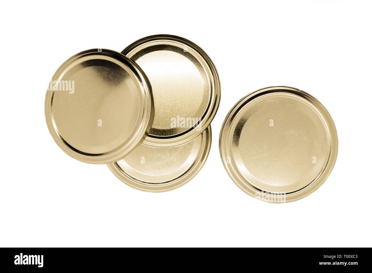Golden jar lids isolated on white background Stock Photo - Alamy