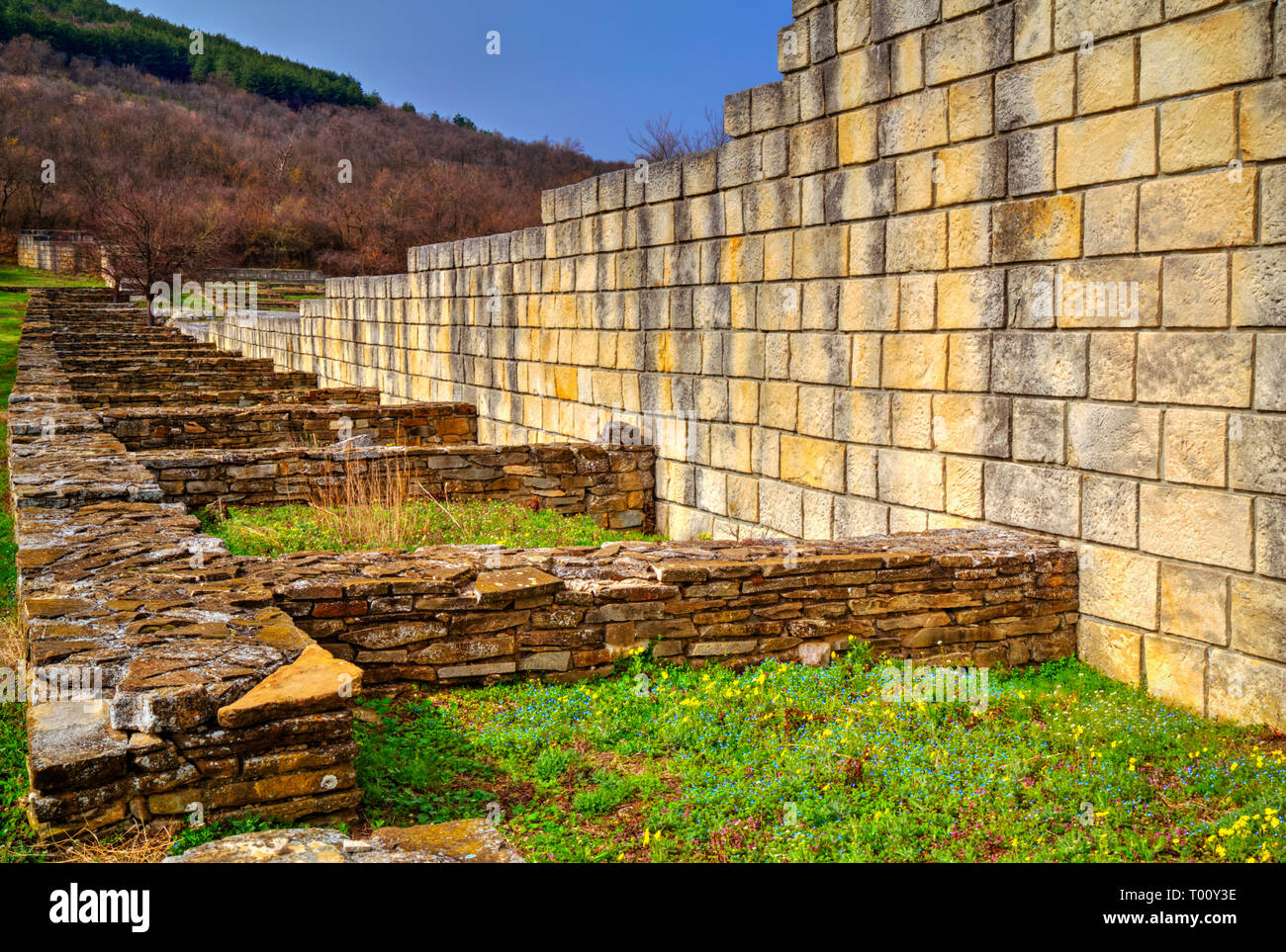 Solid stone wall of ancient fortress Stock Photo - Alamy