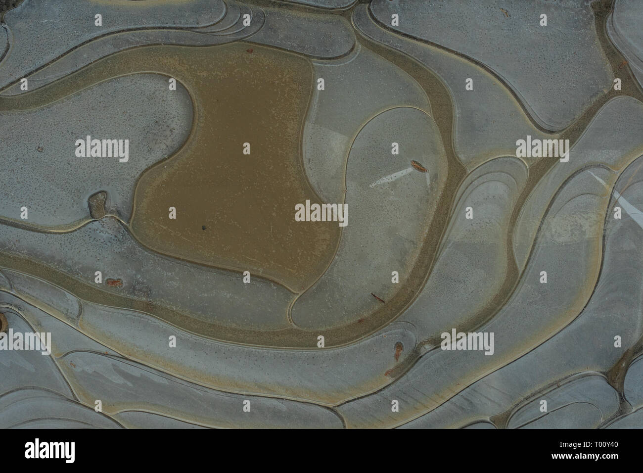 Abstract Swirl in Frozen Muddy Puddle Background Image Stock Photo - Alamy