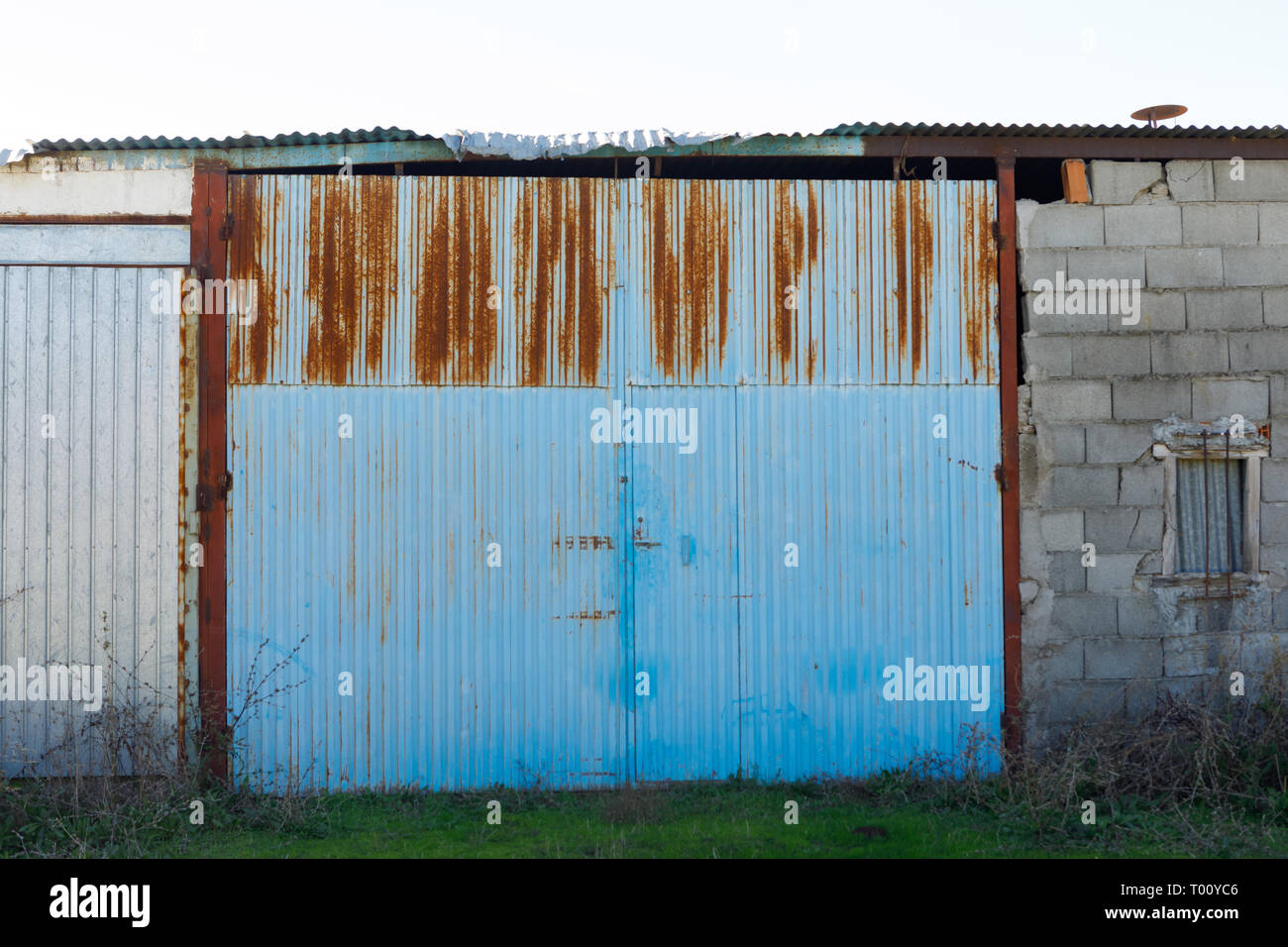 Big rusty door of a warehouse for wallpaper Stock Photo - Alamy