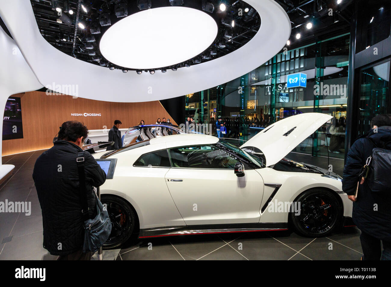 Nissan flagship showroom on the Ginza in Tokyo. Two cars on display ...