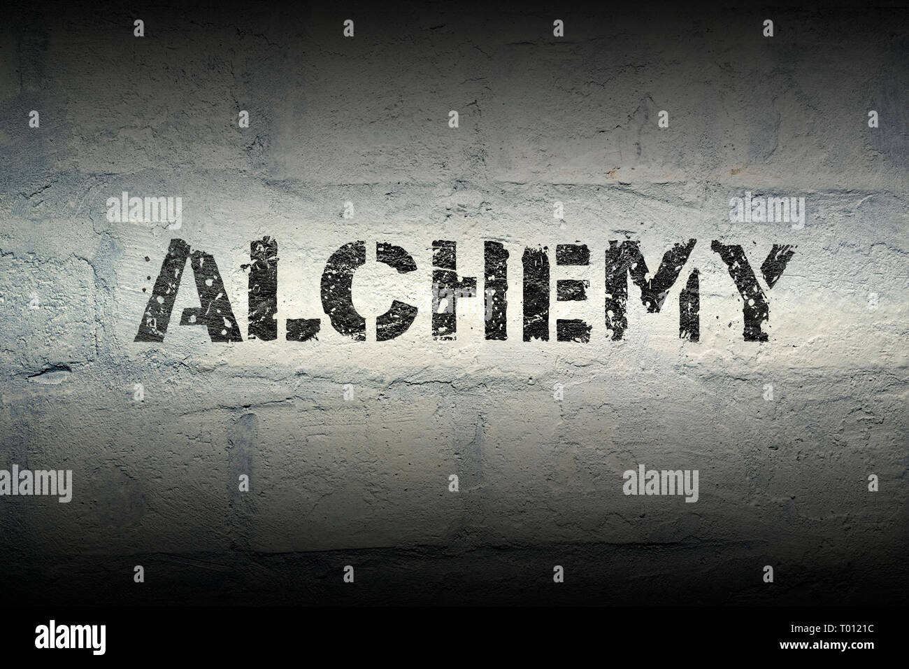 alchemy word stencil print on the grunge white brick wall Stock Photo ...