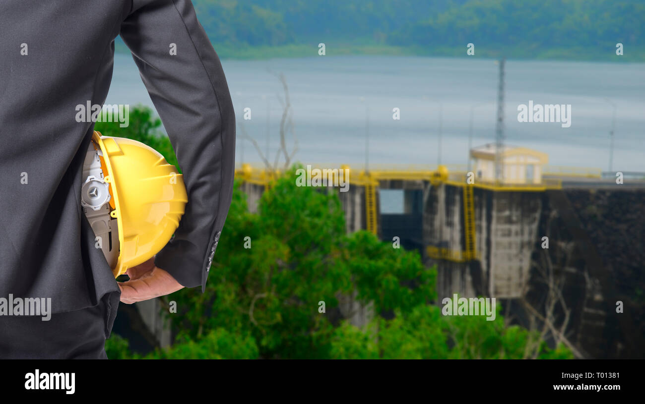 Civil Engineer holding hard hat protection equipment on site ...