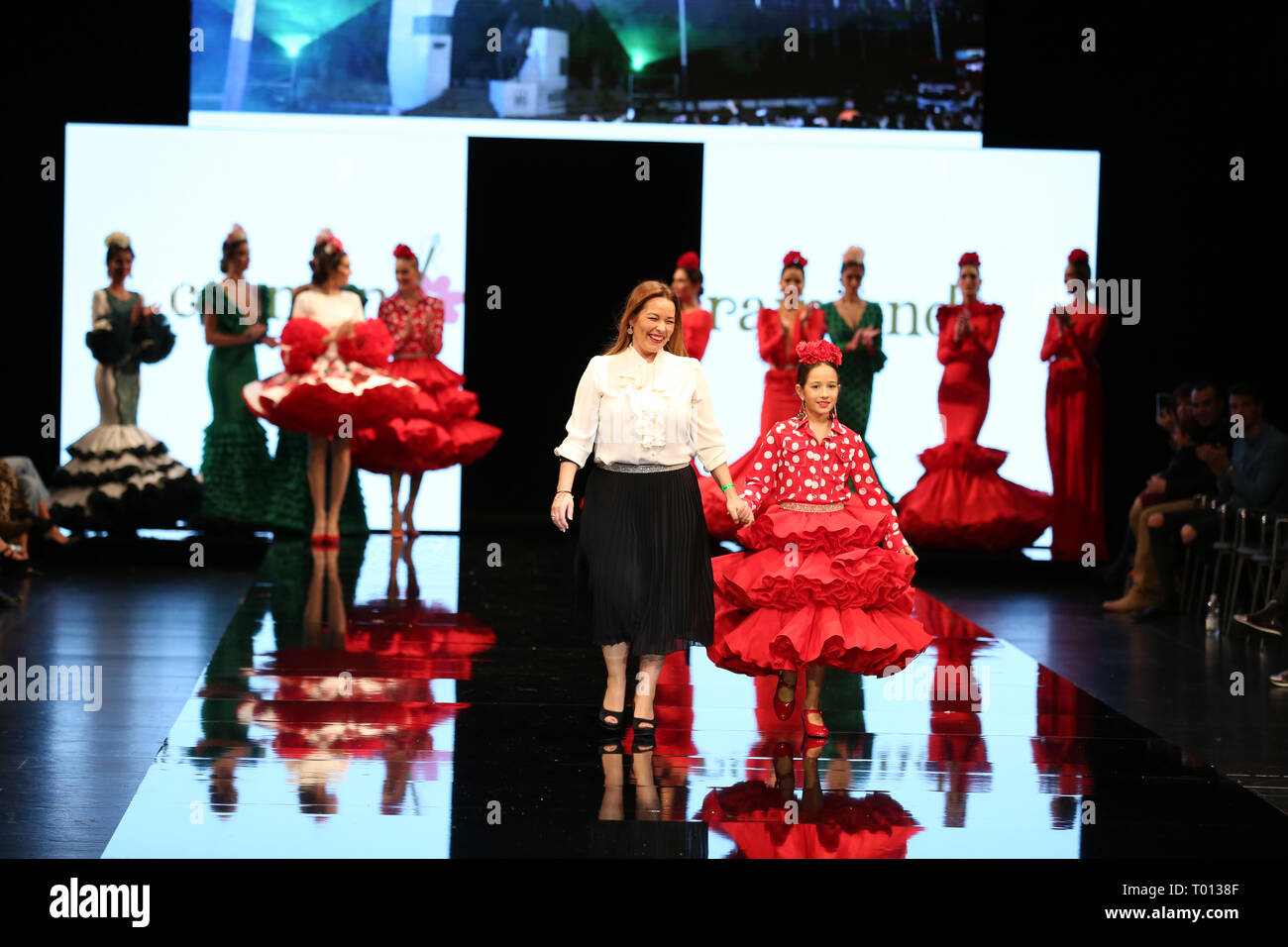 Designer Carmen Raimundo and models on the catwalk Stock Photo - Alamy