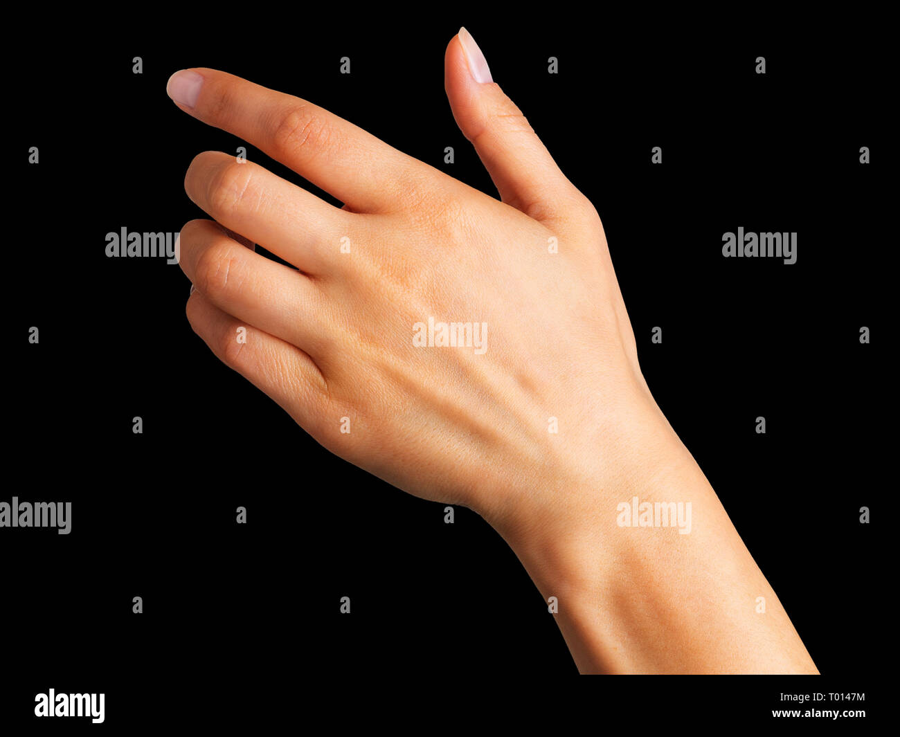 Woman hand with the index finger pointing up or showing direction on ...
