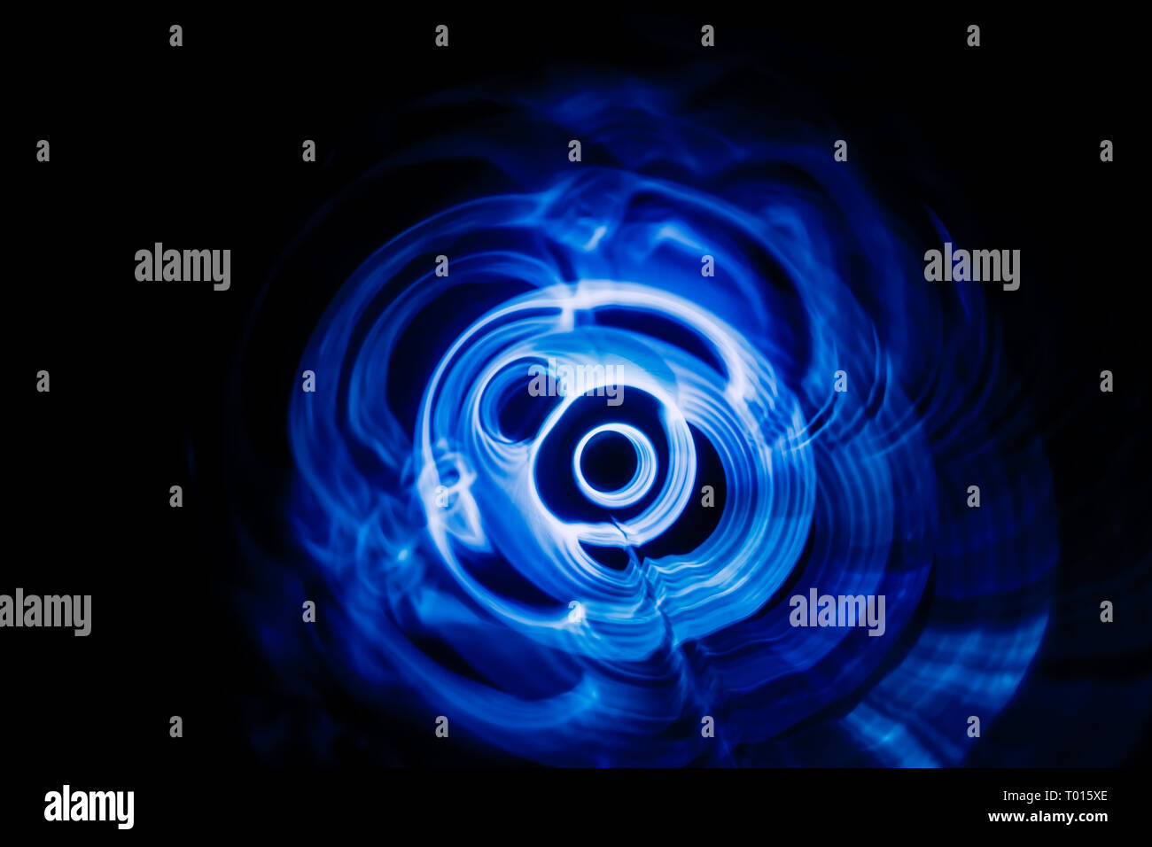Sound waves in the visible blue color in the dark Stock Photo - Alamy
