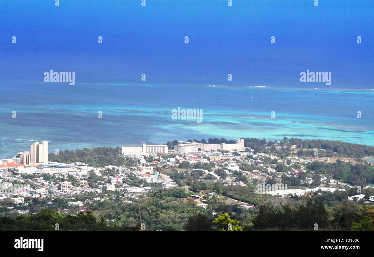 Aerial view of Garapan, with the blue waters of Saipan lagoon in the ...