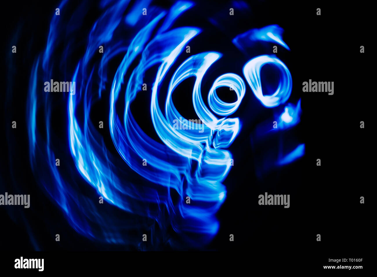 Sound waves in the visible blue color in the dark Stock Photo - Alamy
