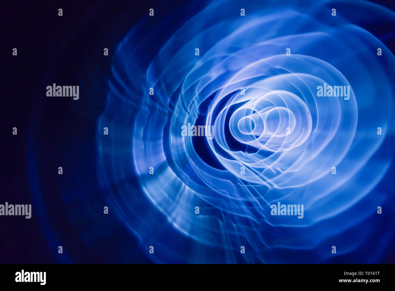 Sound waves in the visible blue color in the dark Stock Photo - Alamy