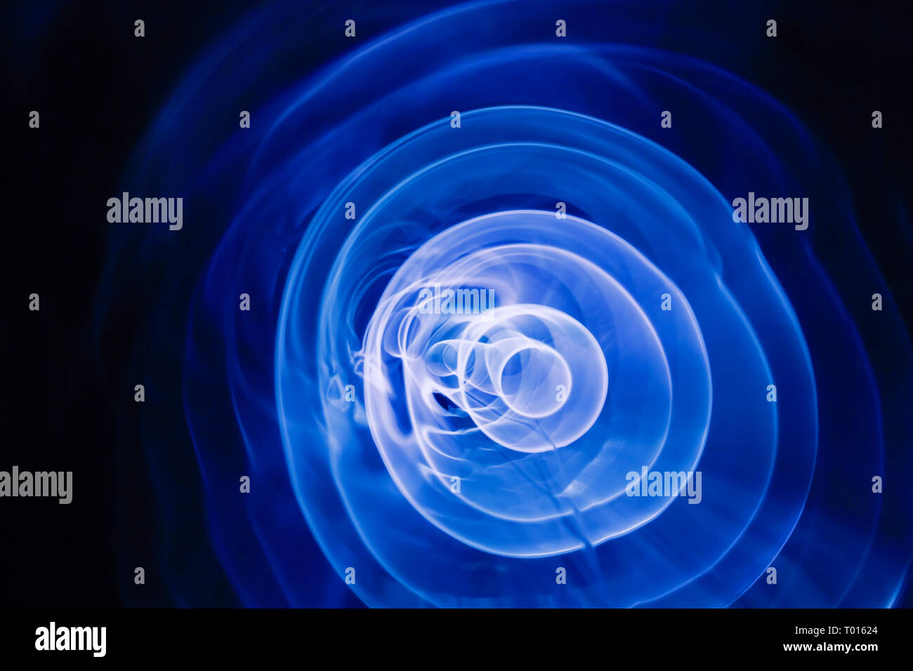 Sound waves in the visible blue color in the dark Stock Photo - Alamy