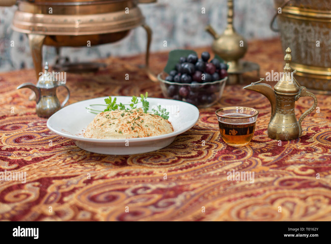 Middle Eastern Tea and Coffee is shown in a formal table setting ...