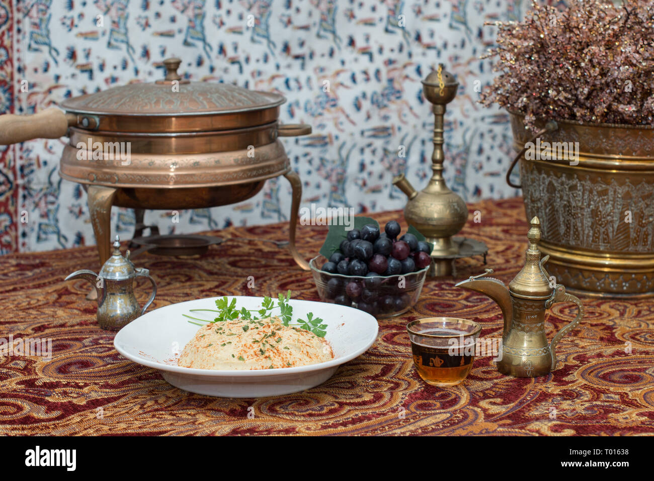 Middle Eastern Tea and Coffee is shown in a formal table setting ...