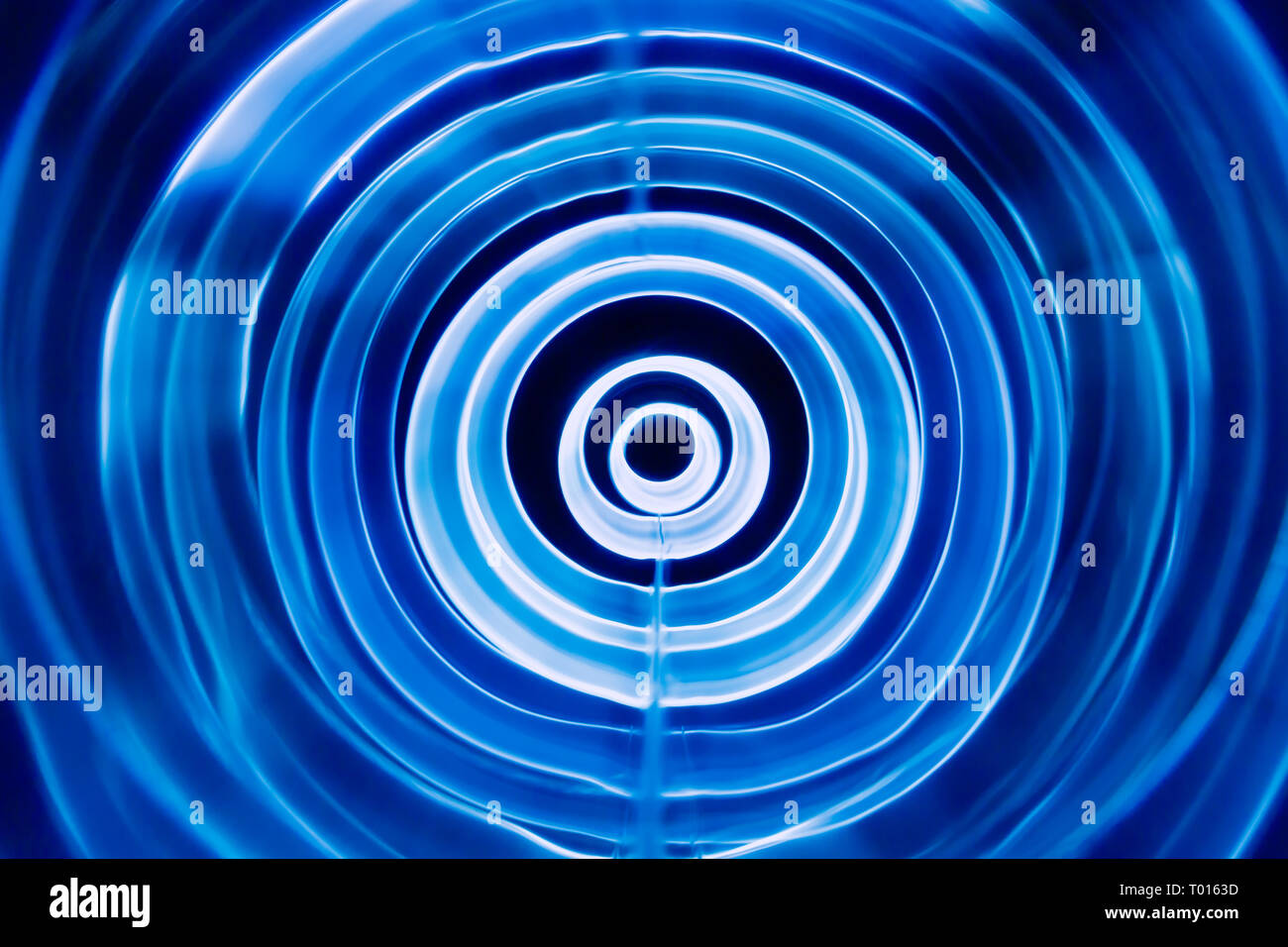 Sound waves in the visible blue color in the dark Stock Photo - Alamy