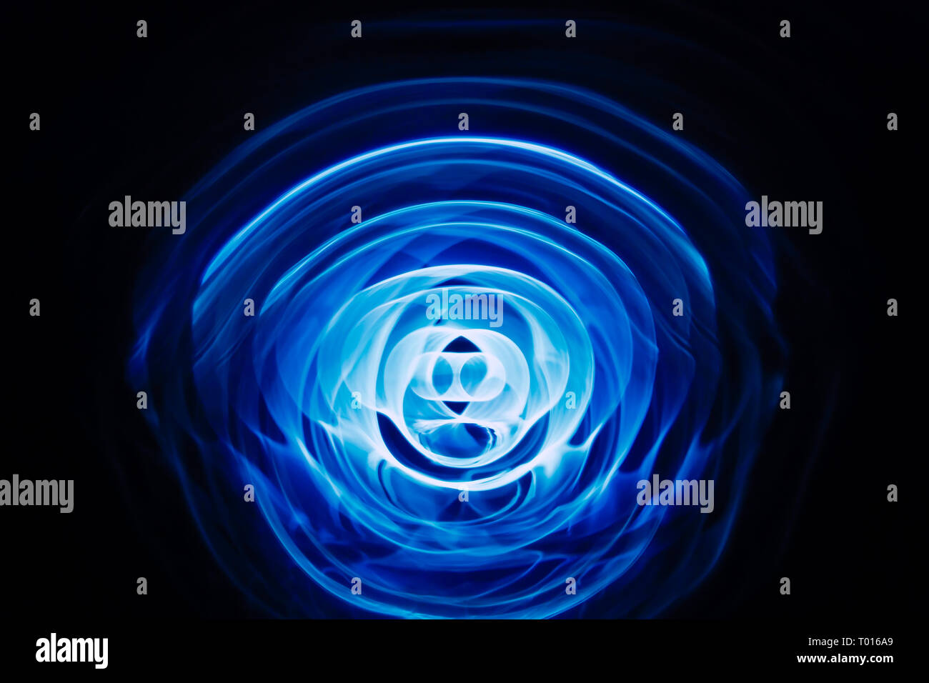 Sound waves in the visible blue color in the dark Stock Photo - Alamy