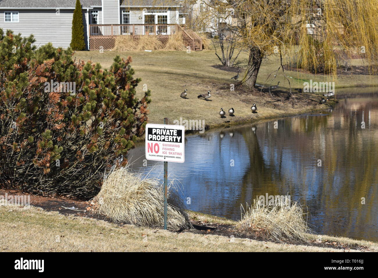 Sign Near Pond Stock Photo - Alamy