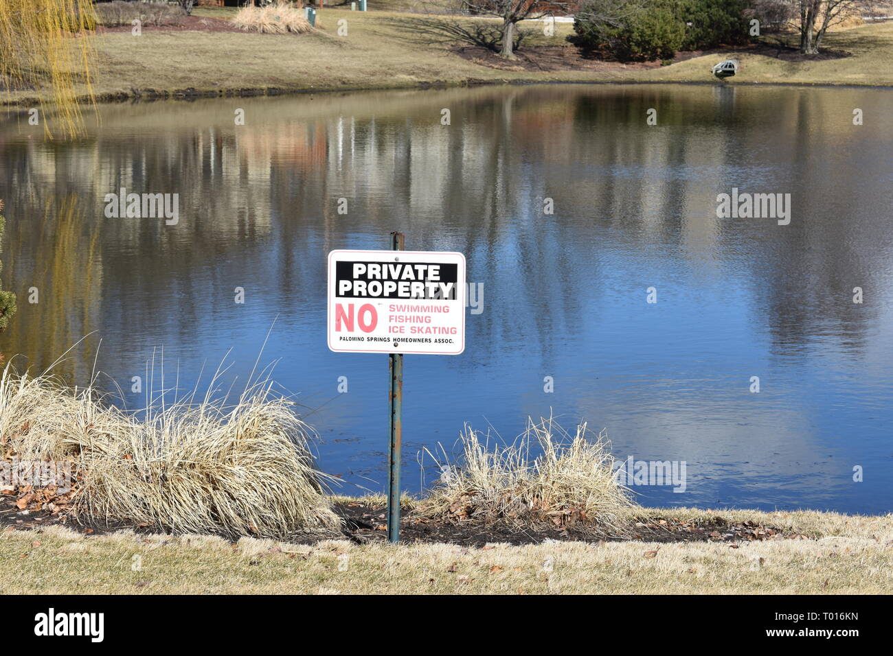 Sign Near Pond Stock Photo - Alamy