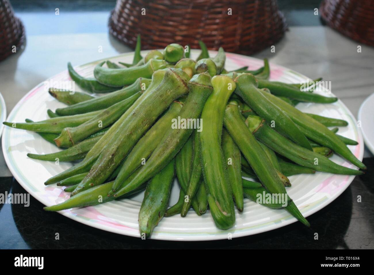 Plate of steamed okra Stock Photo - Alamy