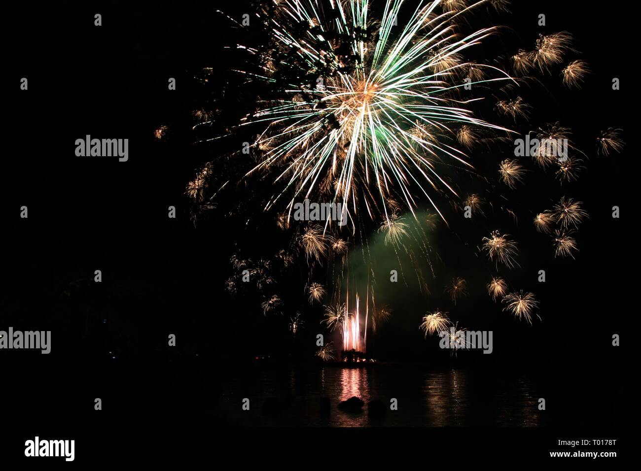 Firework showers in a dark sky background Stock Photo - Alamy