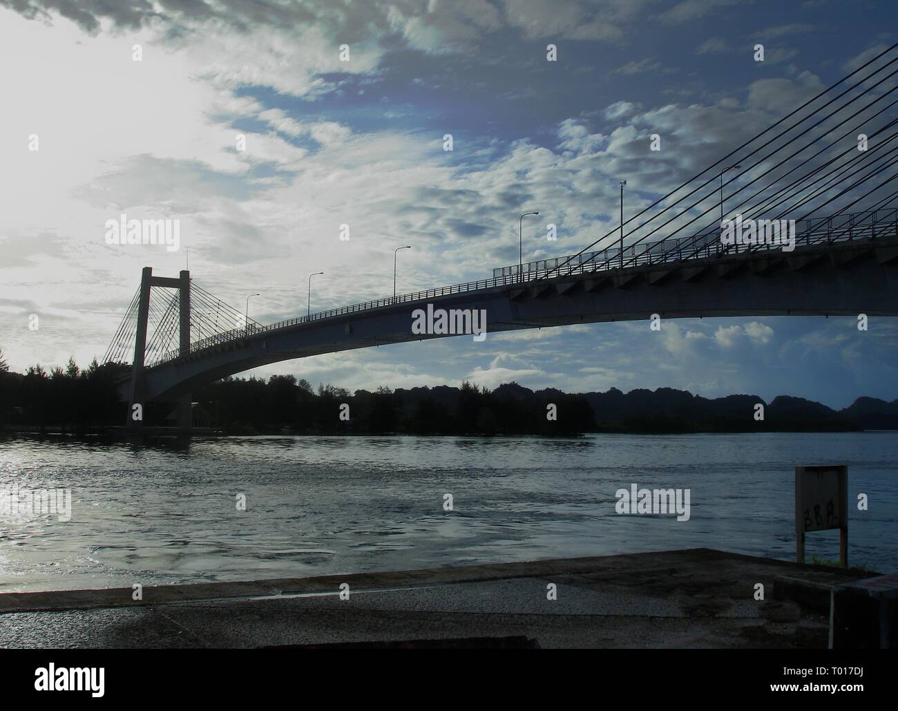 Silhouette of the Japan-Palau Friendship Bridge on a cloudy day, viewed ...